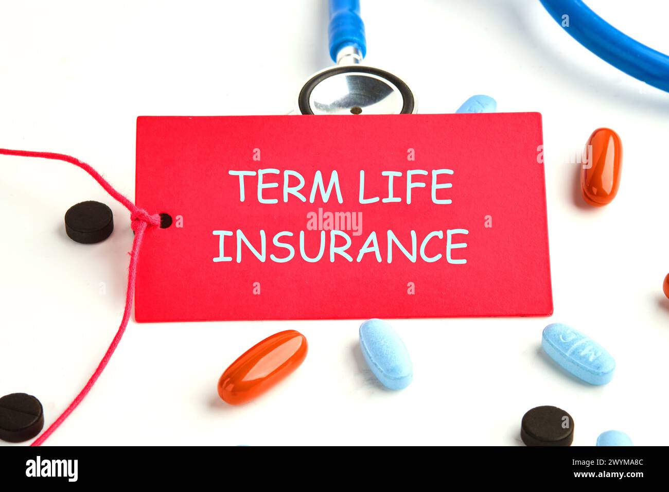 Medical concept. TERM LIFE INSURANCE on a red card on a white ...