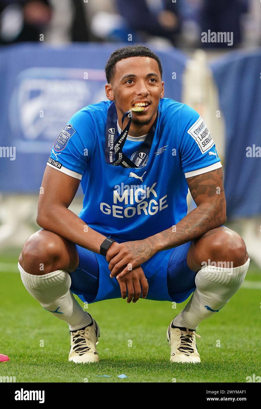 Peterborough United's Romoney Crichlow with his winners medel after his ...