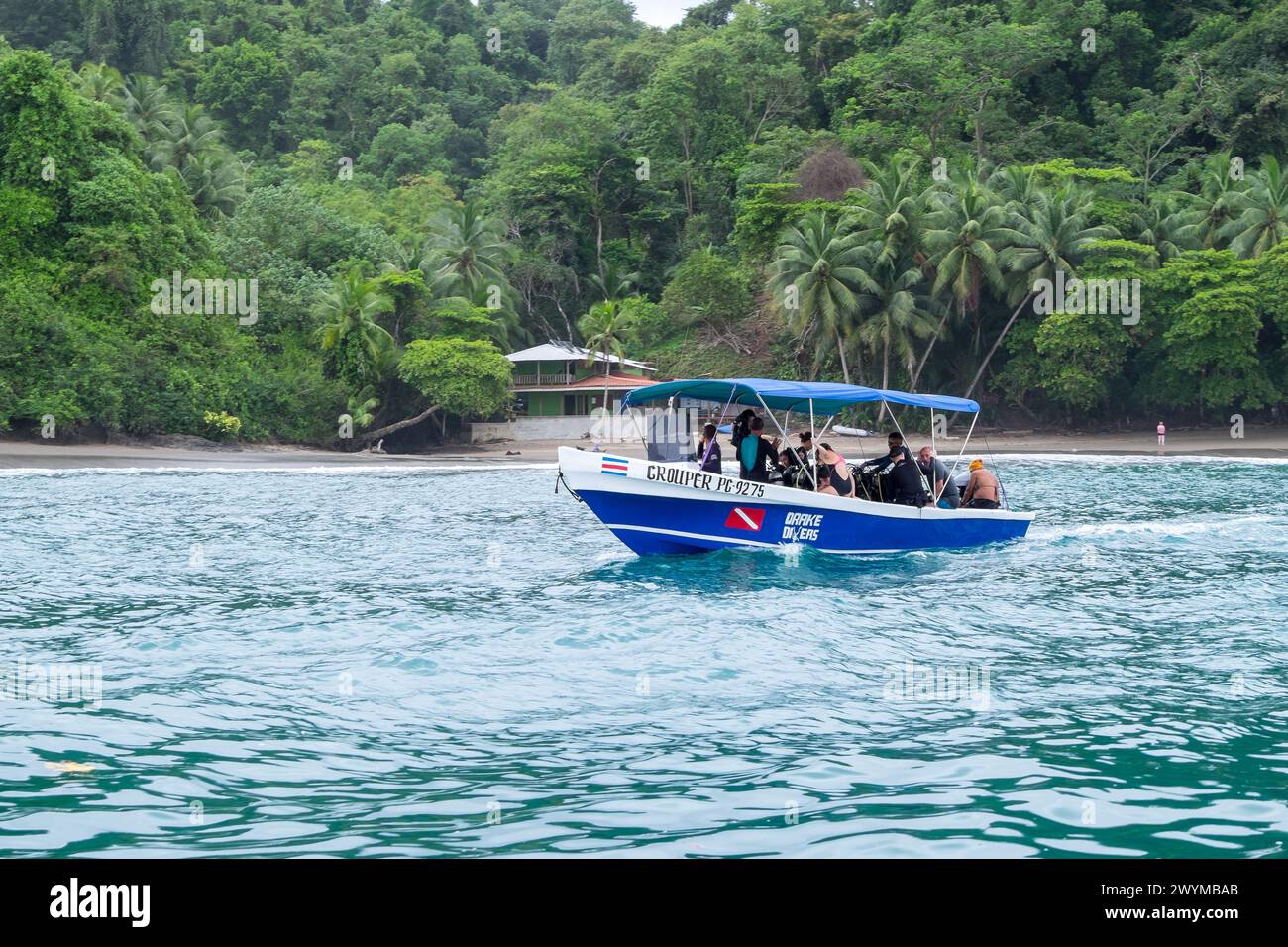 Boat with divers sailing off Caño Island in Puntarenas, Costa Rica ...