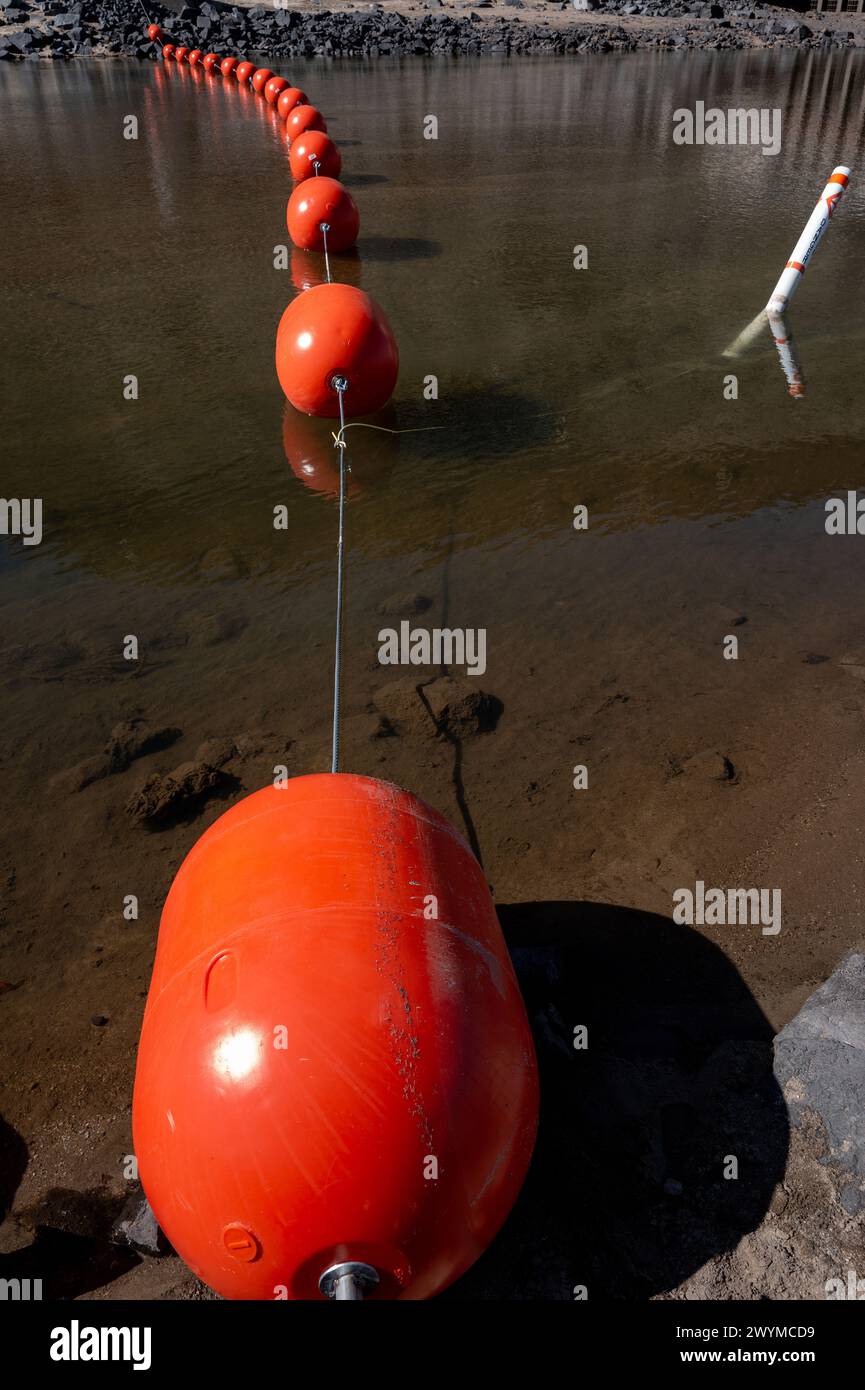 Buoy create a safe boundary at a diversion dam Stock Photo - Alamy