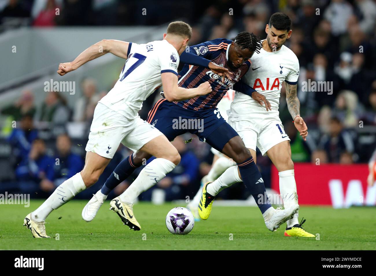 Nottingham Forest's Divock Origi (centre) battles for the beall with ...