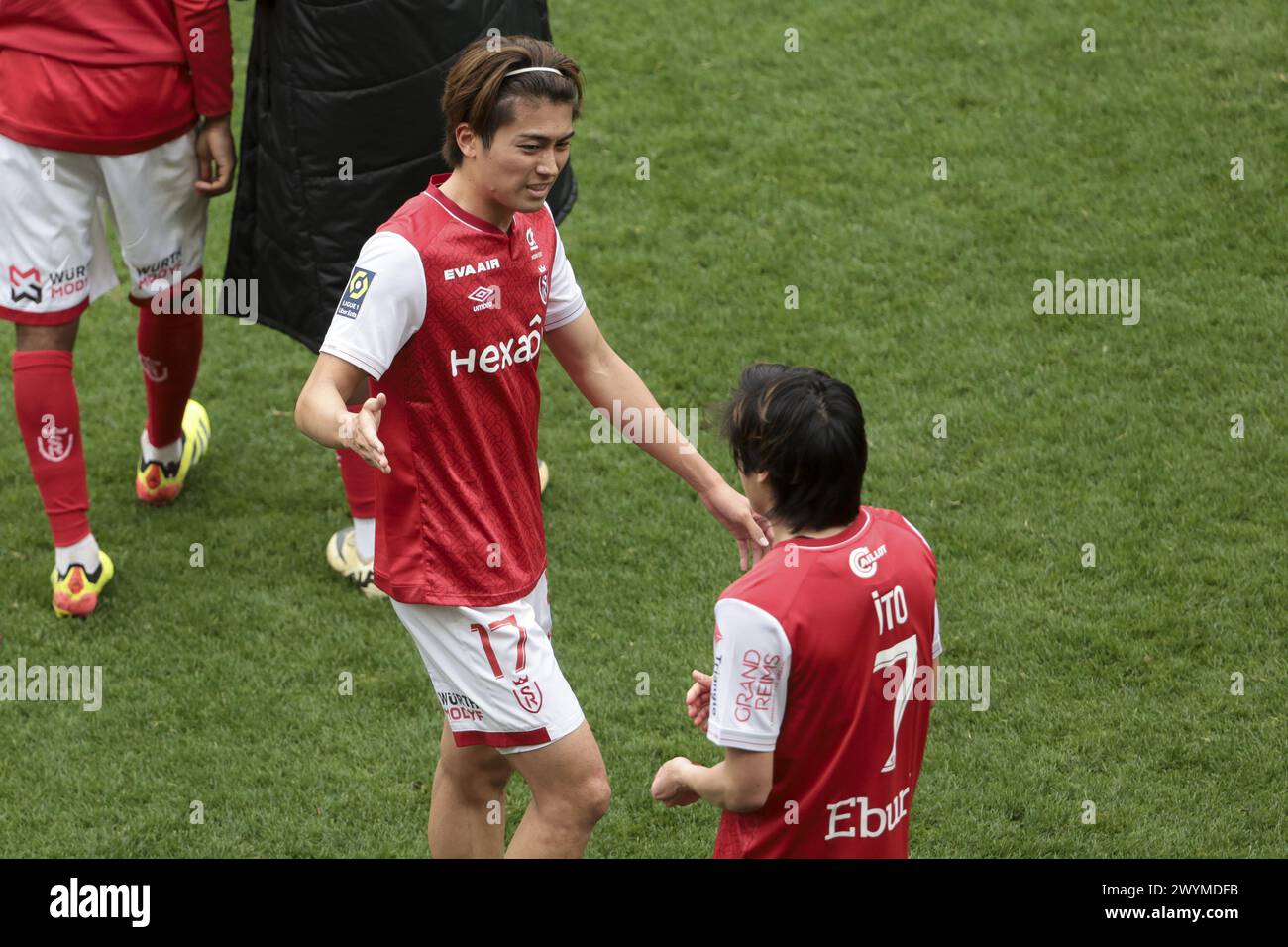 Keito Nakamura of Reims salutes Junya Ito of Reims following the French ...
