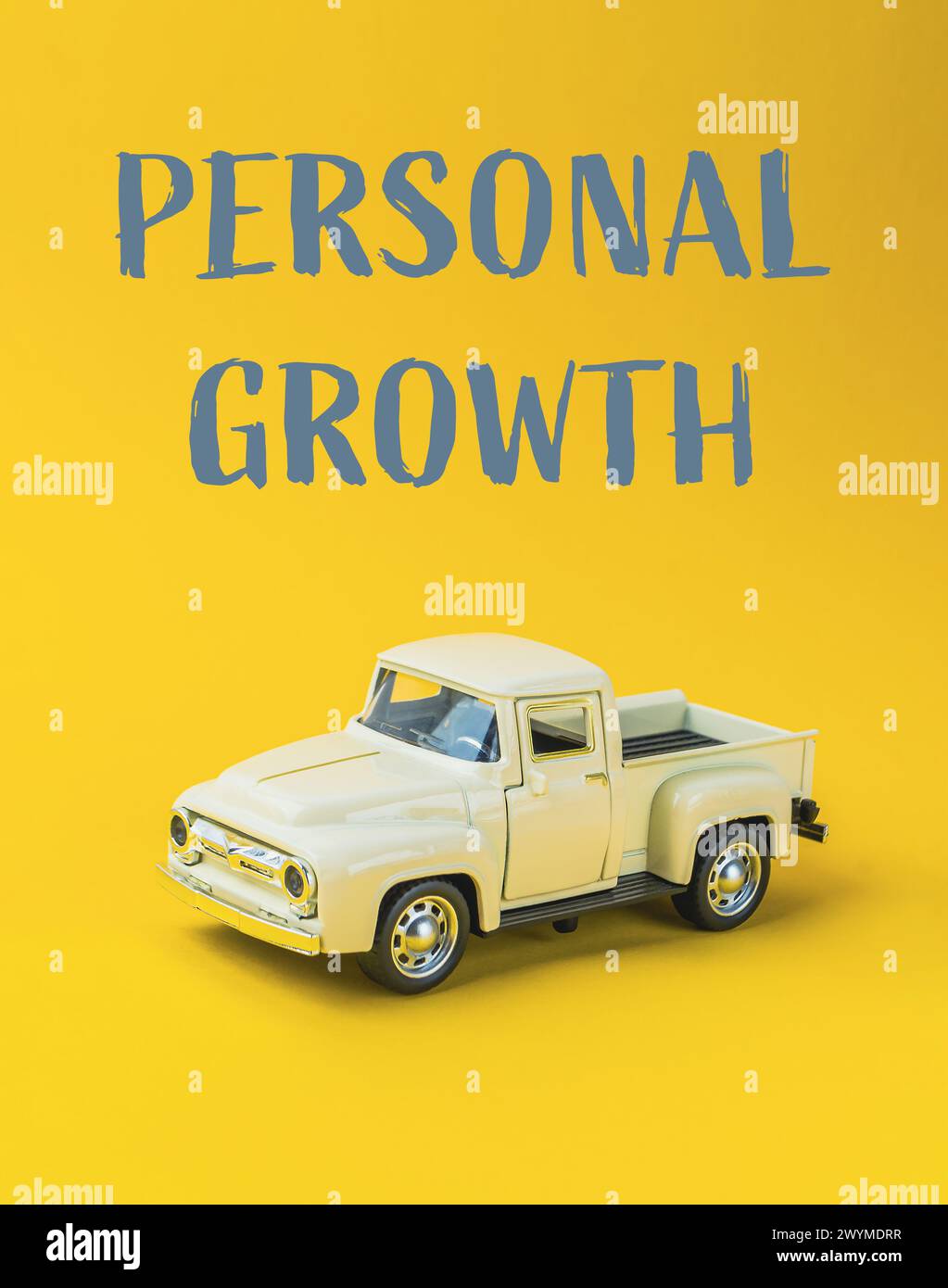 A toy truck is on a yellow background with the words Personal Growth ...