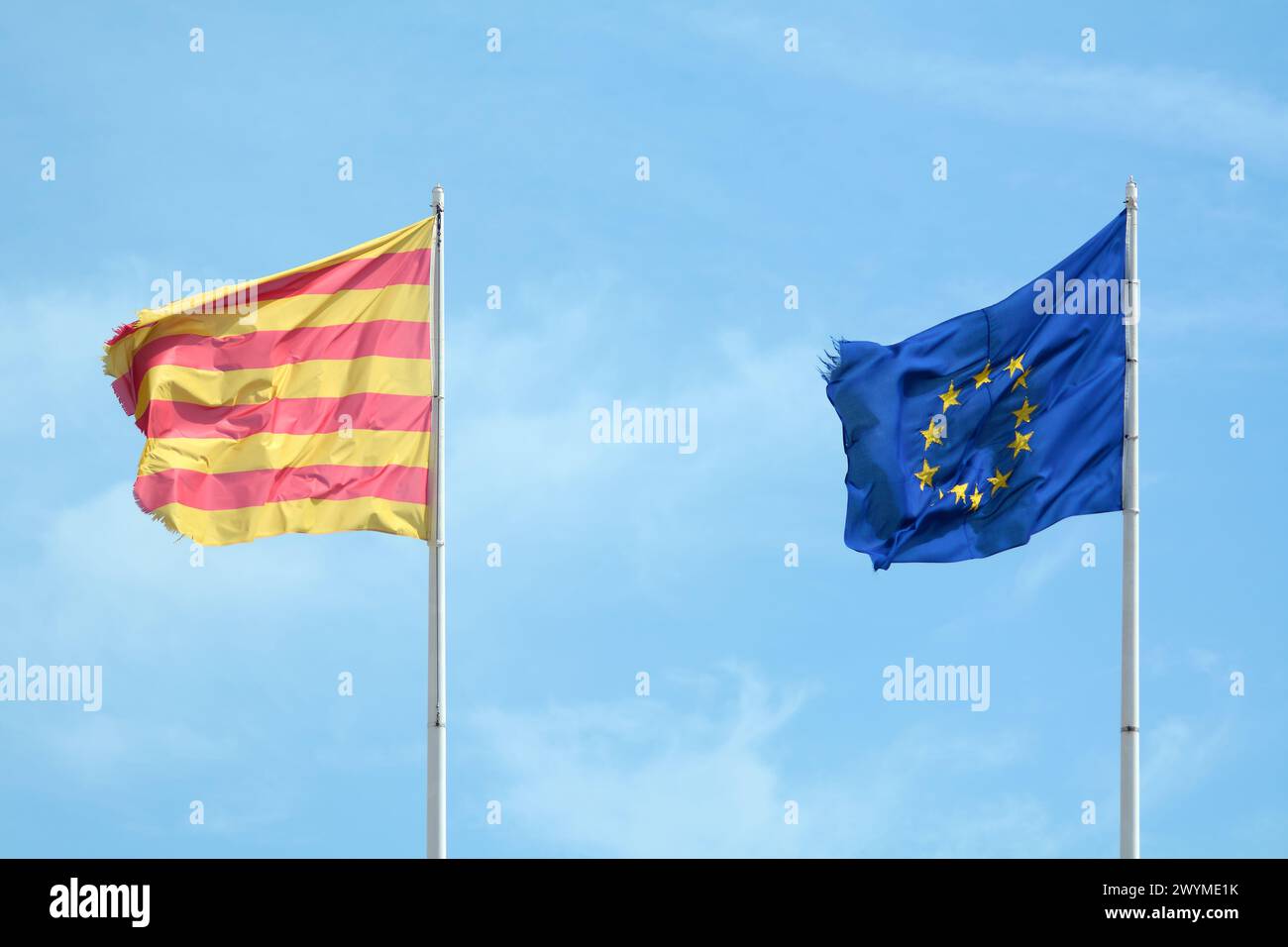 The image captures a symbolic moment where the flag of the European Union and the flag of ...