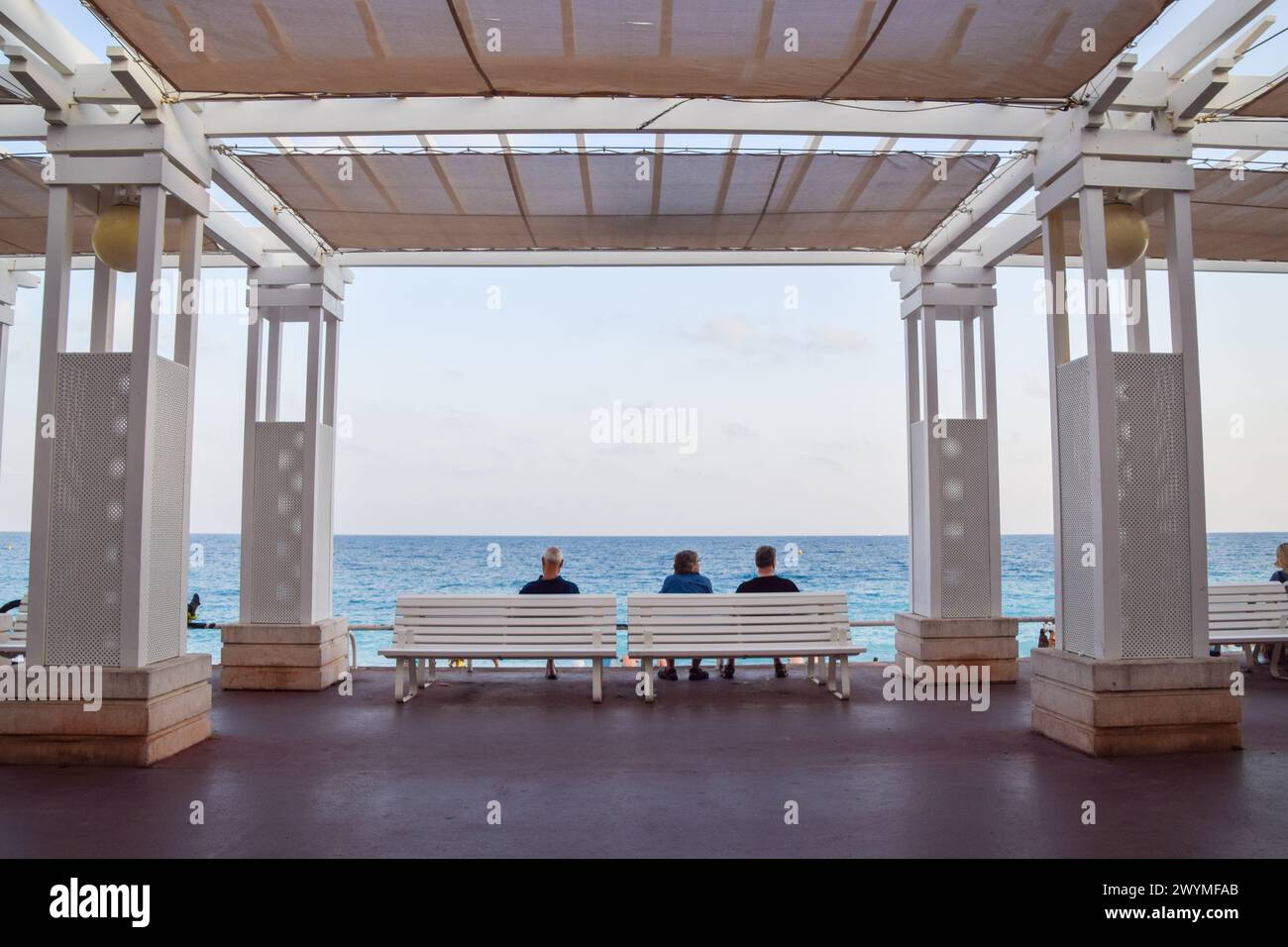 Nice, France. 6th July 2019. People enjoy the view from a seaside ...