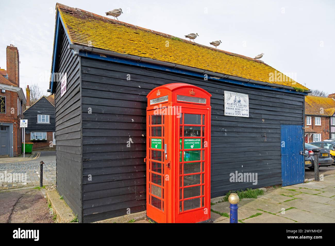 Red former telephone booth, shed, seagulls, harbour, Folkestone, Kent ...