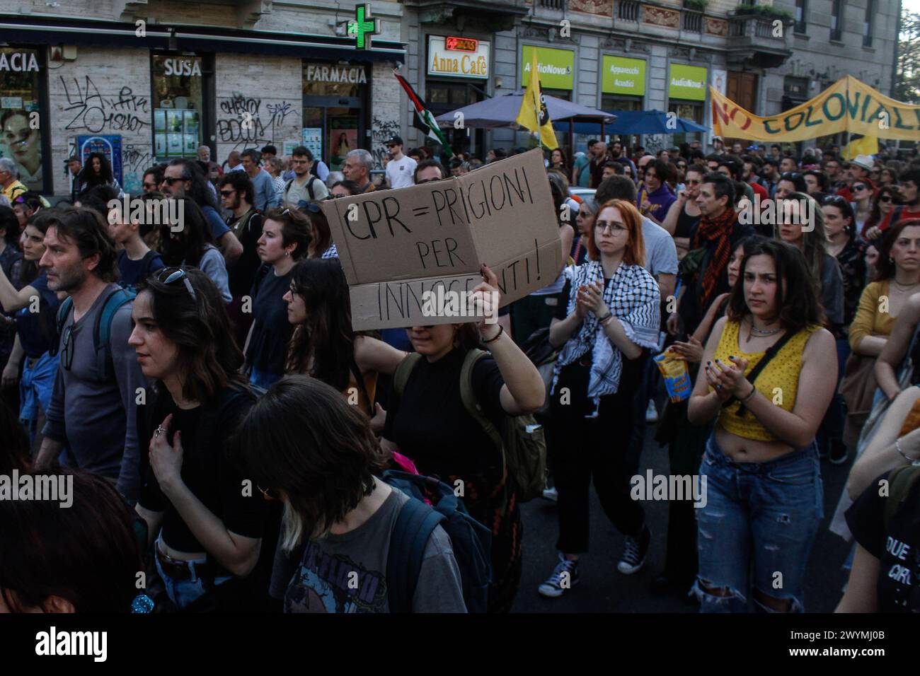 A protester holds a placard expressing his opinion during a ...