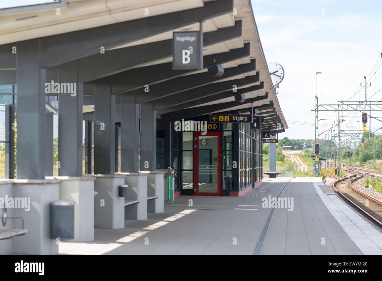 Train station with track and signals Stock Photo - Alamy