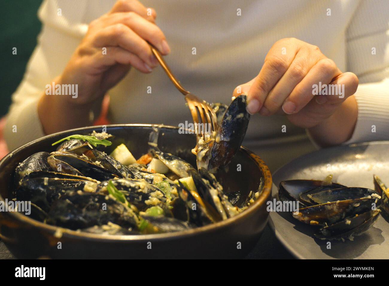 Person eating using fork hi-res stock photography and images - Alamy
