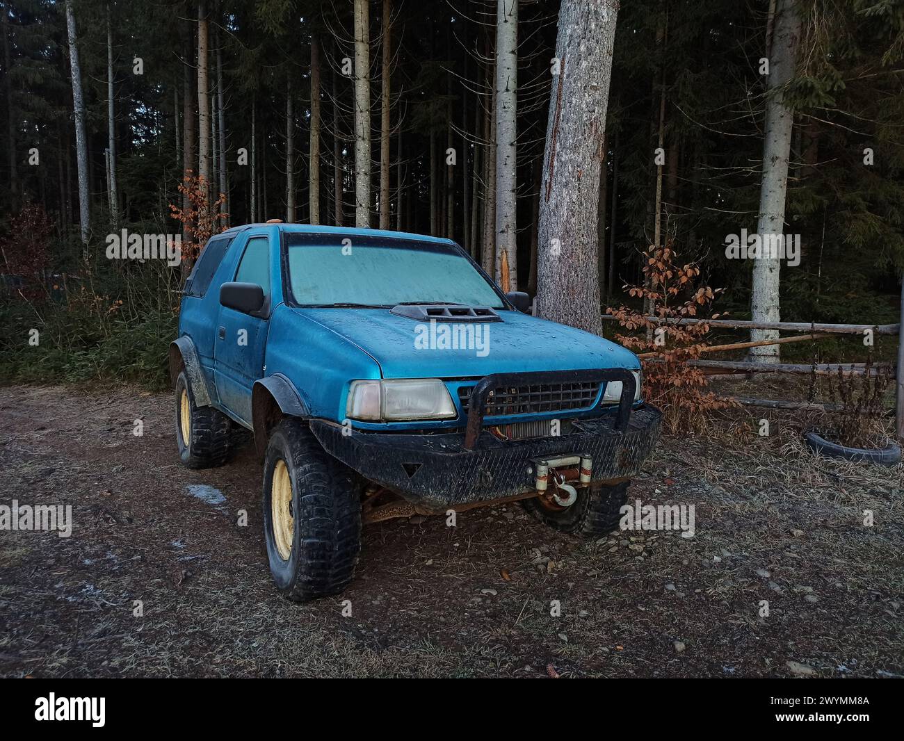 Old SUV car with winch in the forest Stock Photo - Alamy