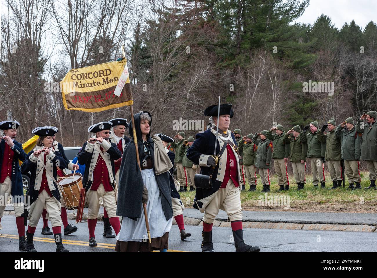 Reenactors with the Concord Minute Men marching by the Concord ...