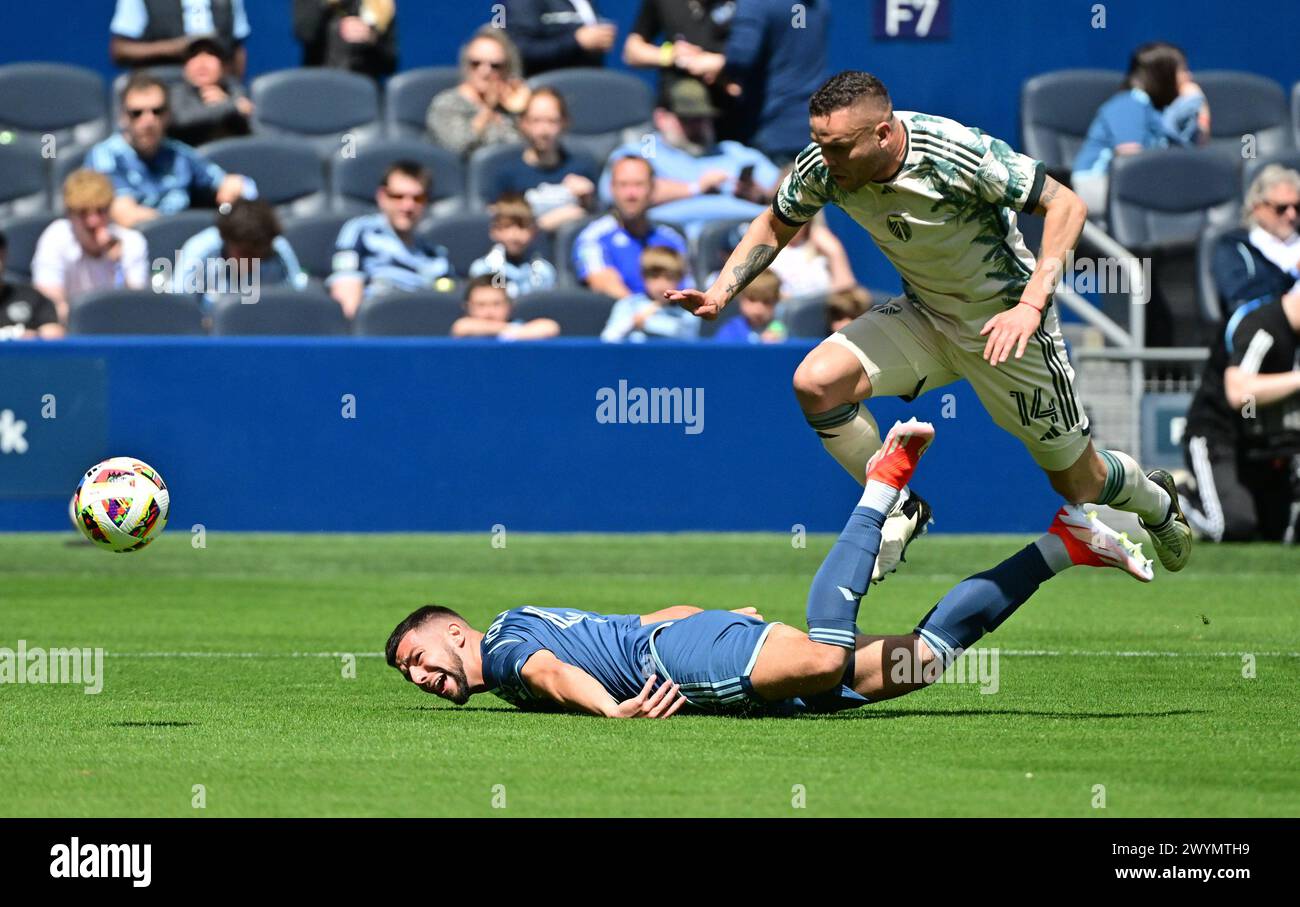 Portland Timbers forward Jonathan Rodriguez (14) leaps over Sporting ...