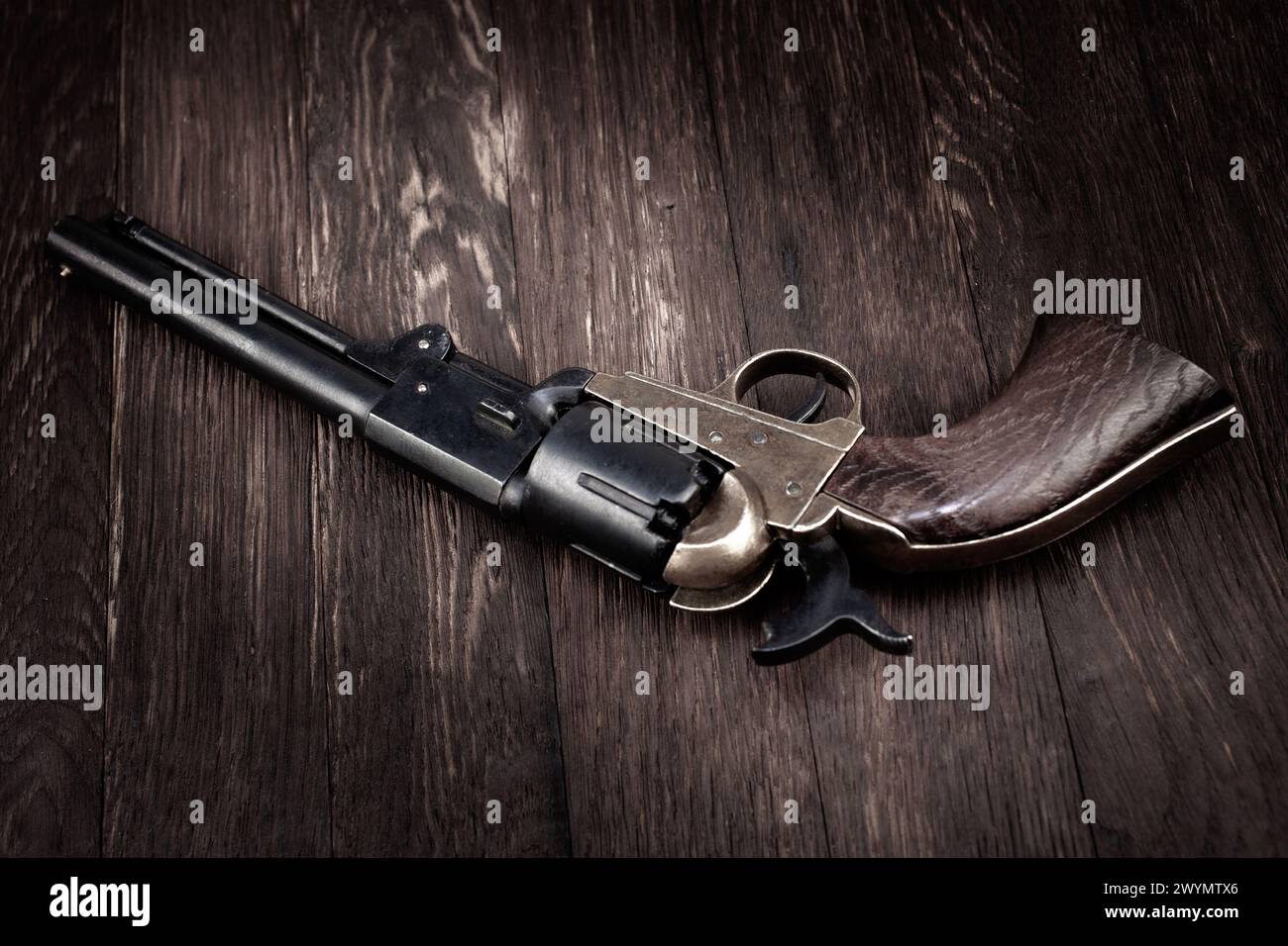 Old West gun. Percussion Army Revolver on wooden table Stock Photo - Alamy