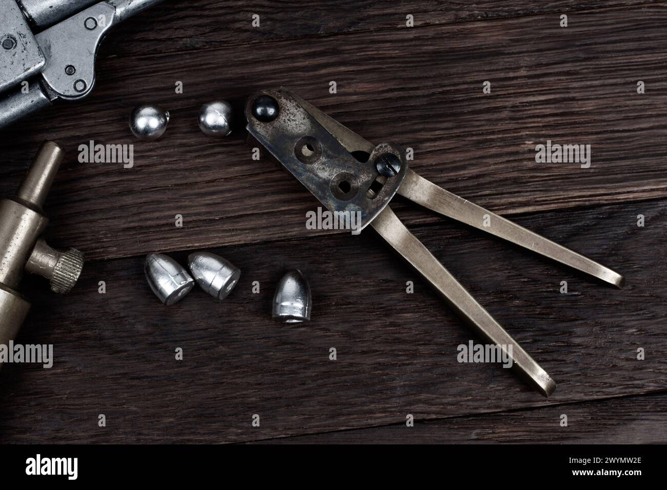 Antique old west bullet mold with bullets for revolver. Isolated on ...