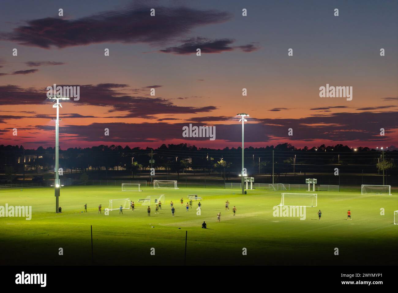 Illuminated public sports arena in North Port, Florida with people ...