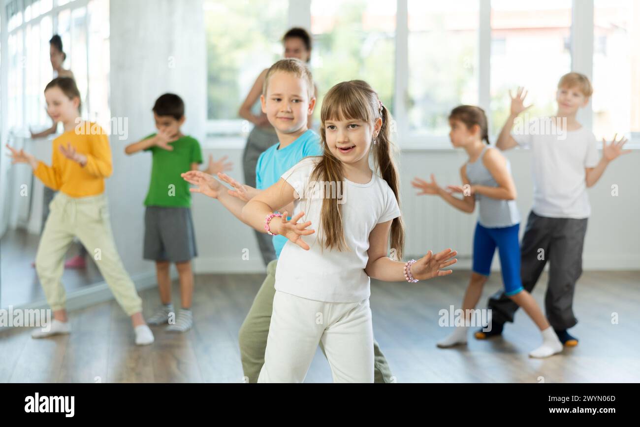 Dance lesson for children - girls and boys learn modern dances in pairs ...