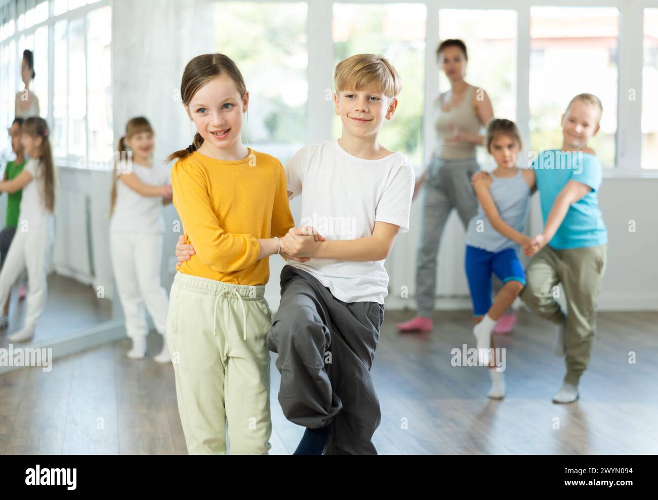 Group of children dancing couple twist dance Stock Photo - Alamy