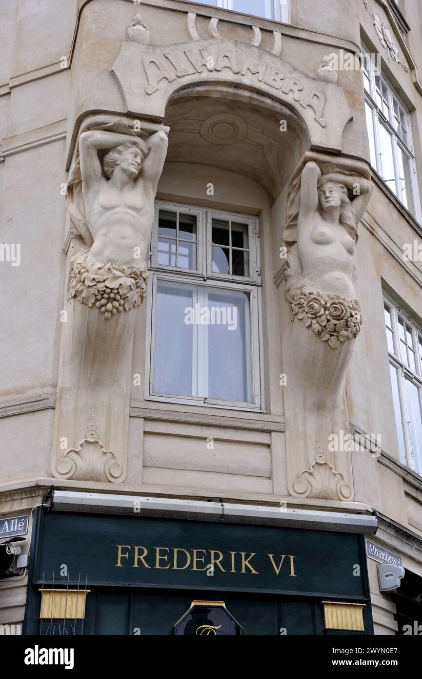 Architectural detail fo Adam and Eve like statues adorning an apartment ...