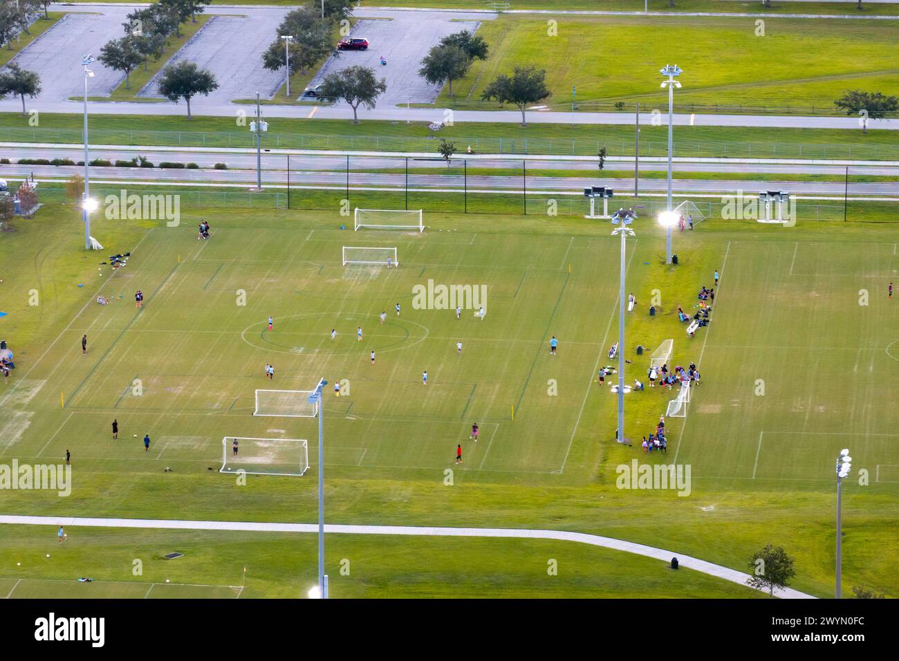 Diverse children playing football hi-res stock photography and images ...