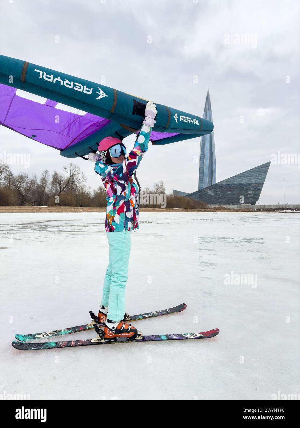 Russia, St.Petersburg, 14 March 2024: A girl in bright colored ski gear ...