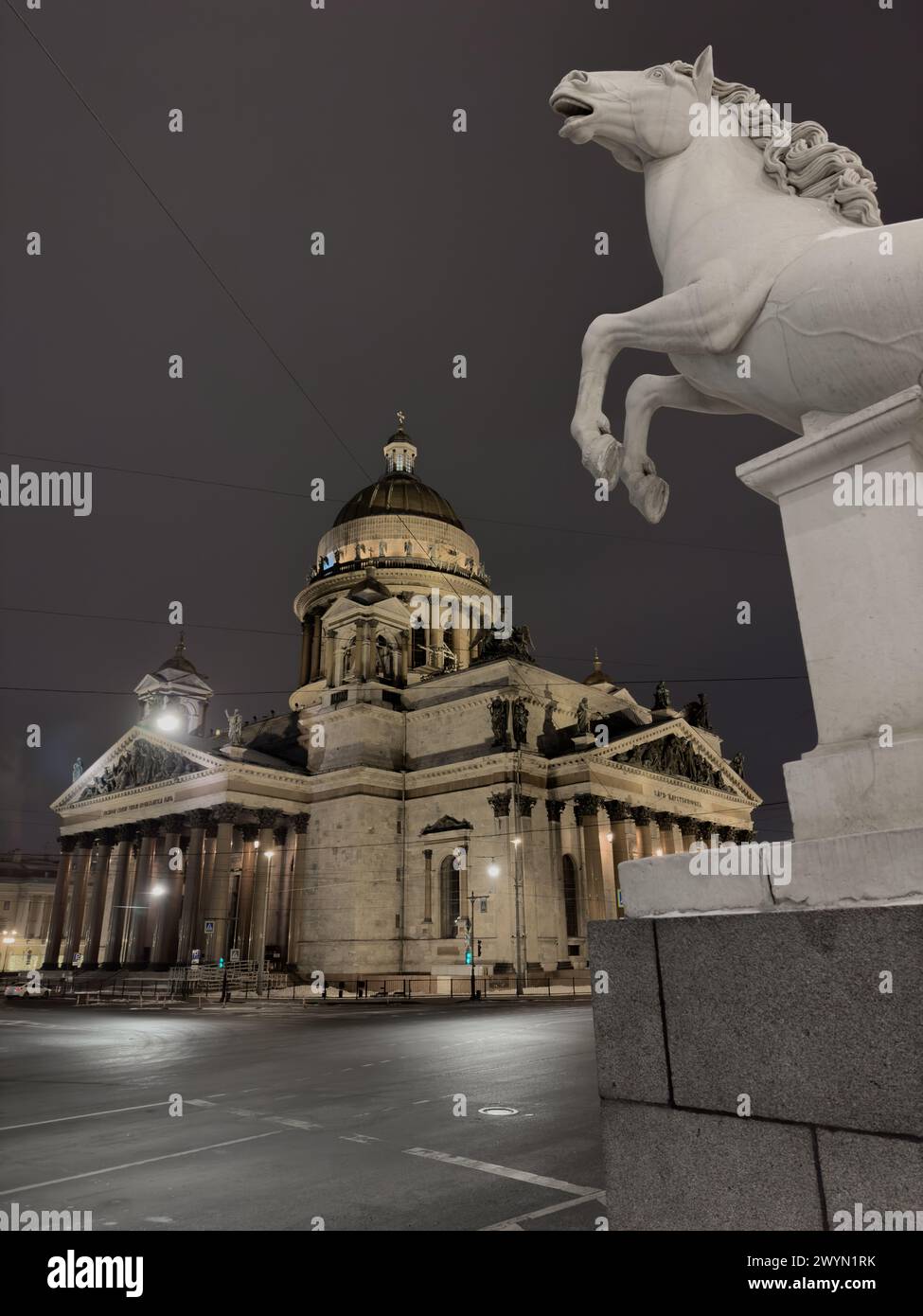 Night view of frozen the monument St. Isaac's Cathedral in frost after ...