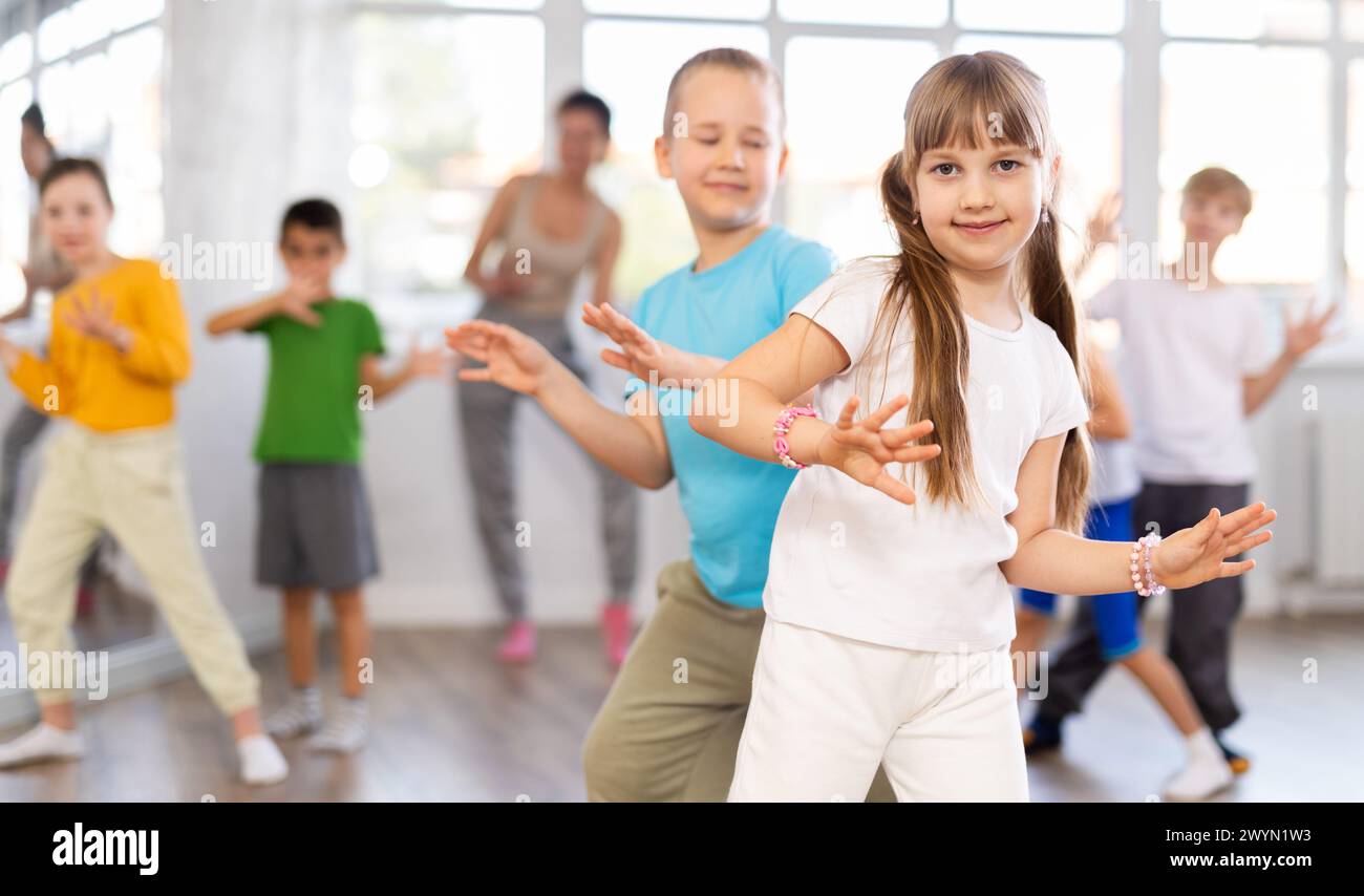 Group of children dancing couple twist dance Stock Photo - Alamy