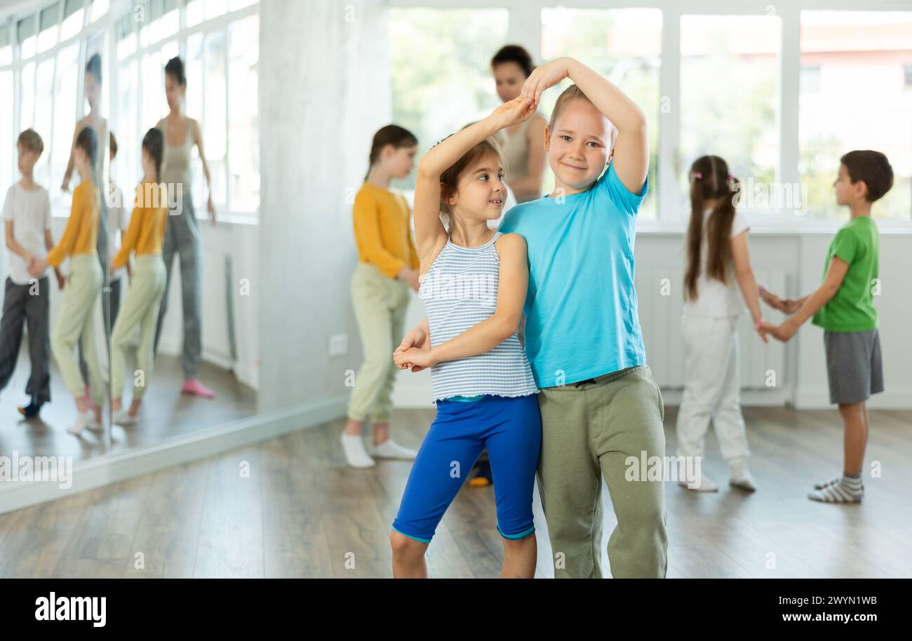 Preteen girls and boys learn to dance classical dances in choreographic ...