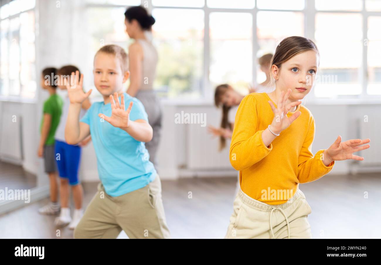 Dance lesson for children - girls and boys learn modern dances in pairs ...
