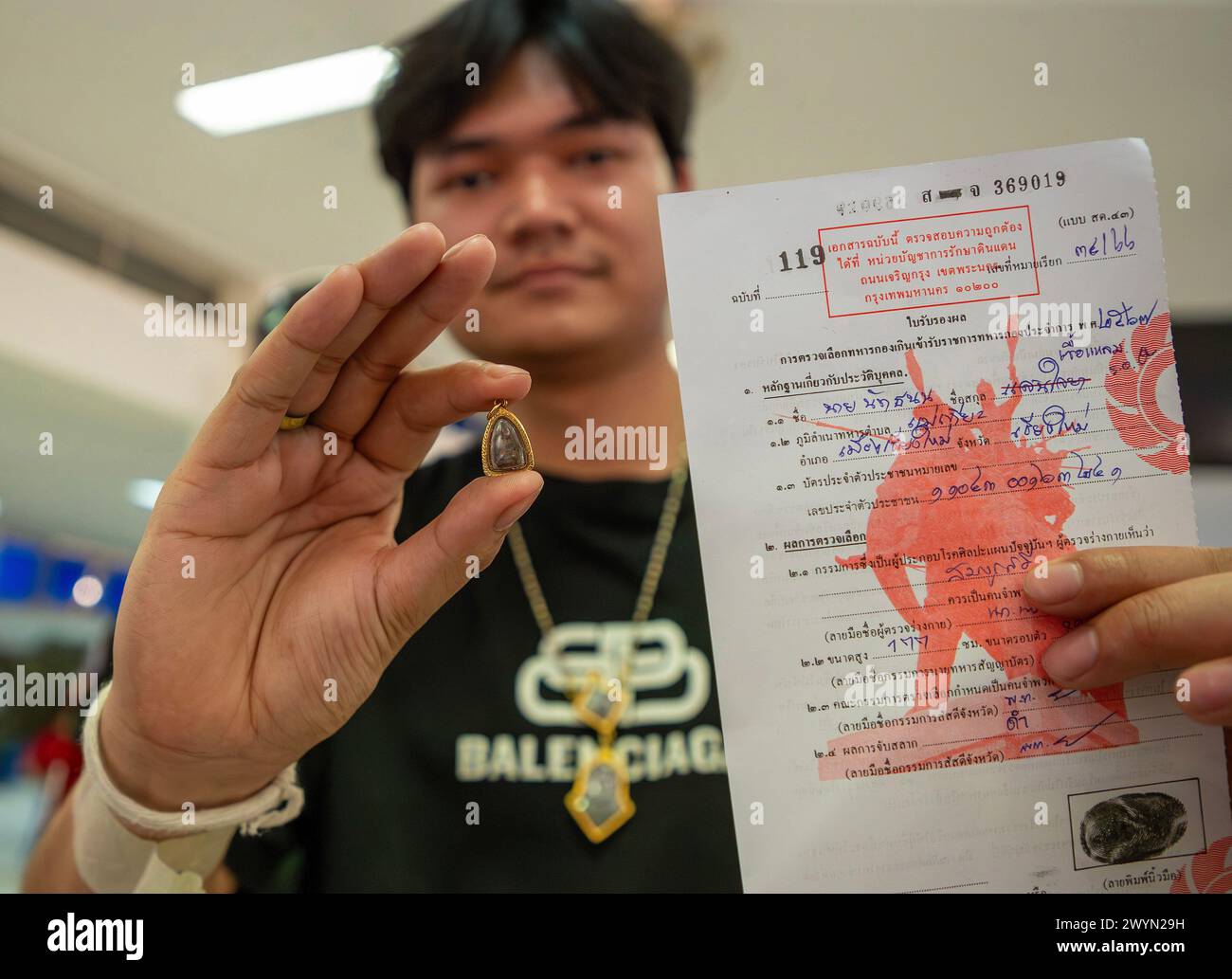 Chiang Mai, Thailand. 07th Apr, 2024. A Thai man seen showing an amulet ...