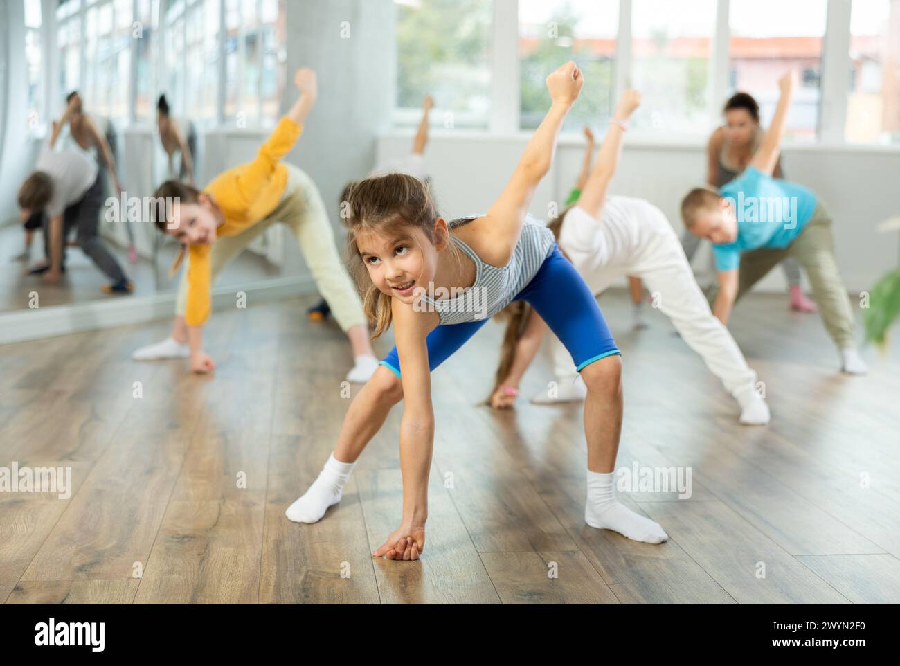 Group of children warming up before dance class Stock Photo - Alamy