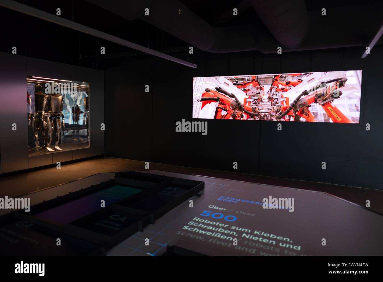 Tesla Bot Optimus robotic humanoid in GIGA TESLA FACTORY lobby ...