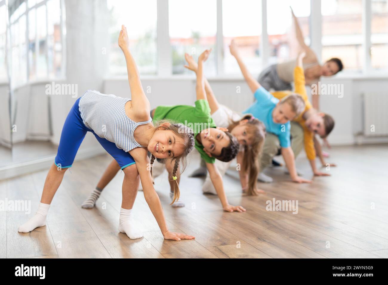 Group of children warming up before dance class Stock Photo - Alamy