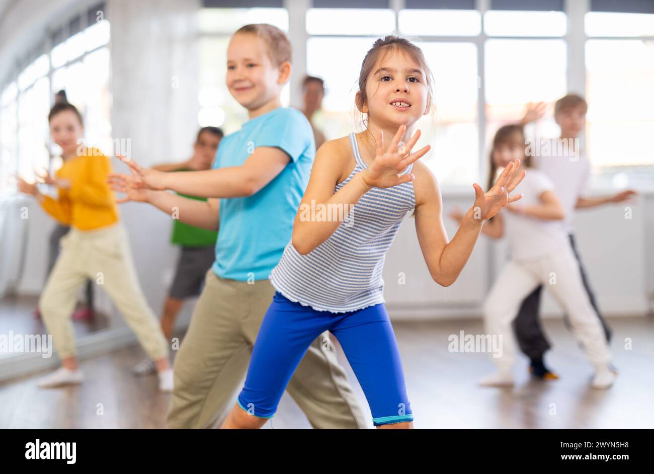 Dance lesson for children - girls and boys learn modern dances in pairs ...