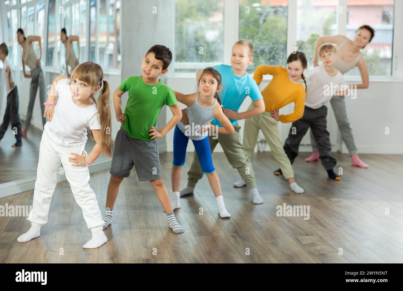 Group of children warming up before dance class Stock Photo - Alamy