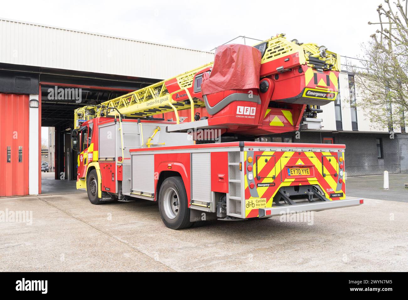 off side rear view of a fire engine returning to depot in Lewisham fire ...