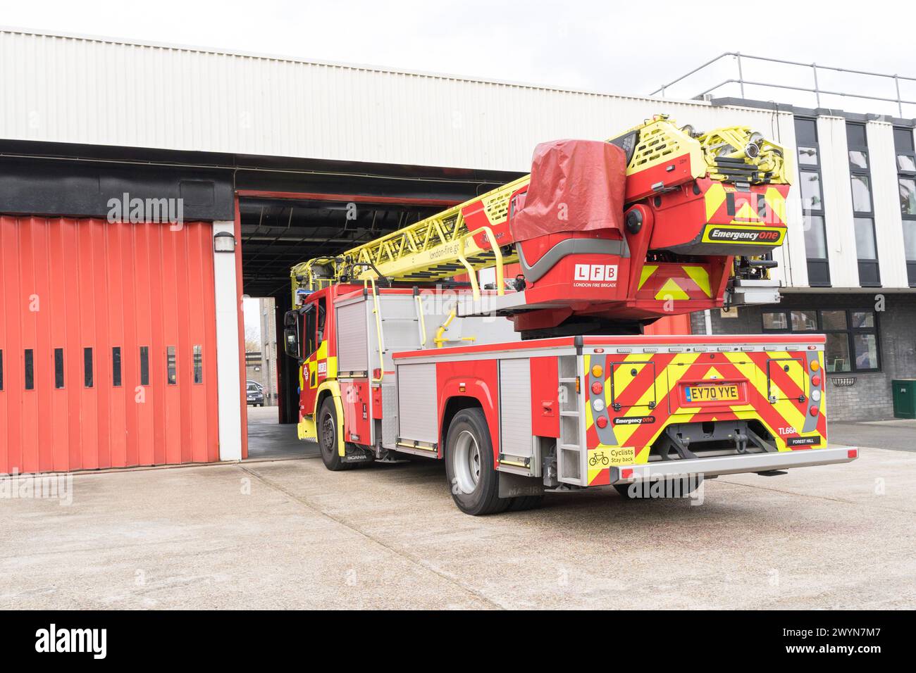off side rear view of a fire engine returning to depot in Lewisham fire ...