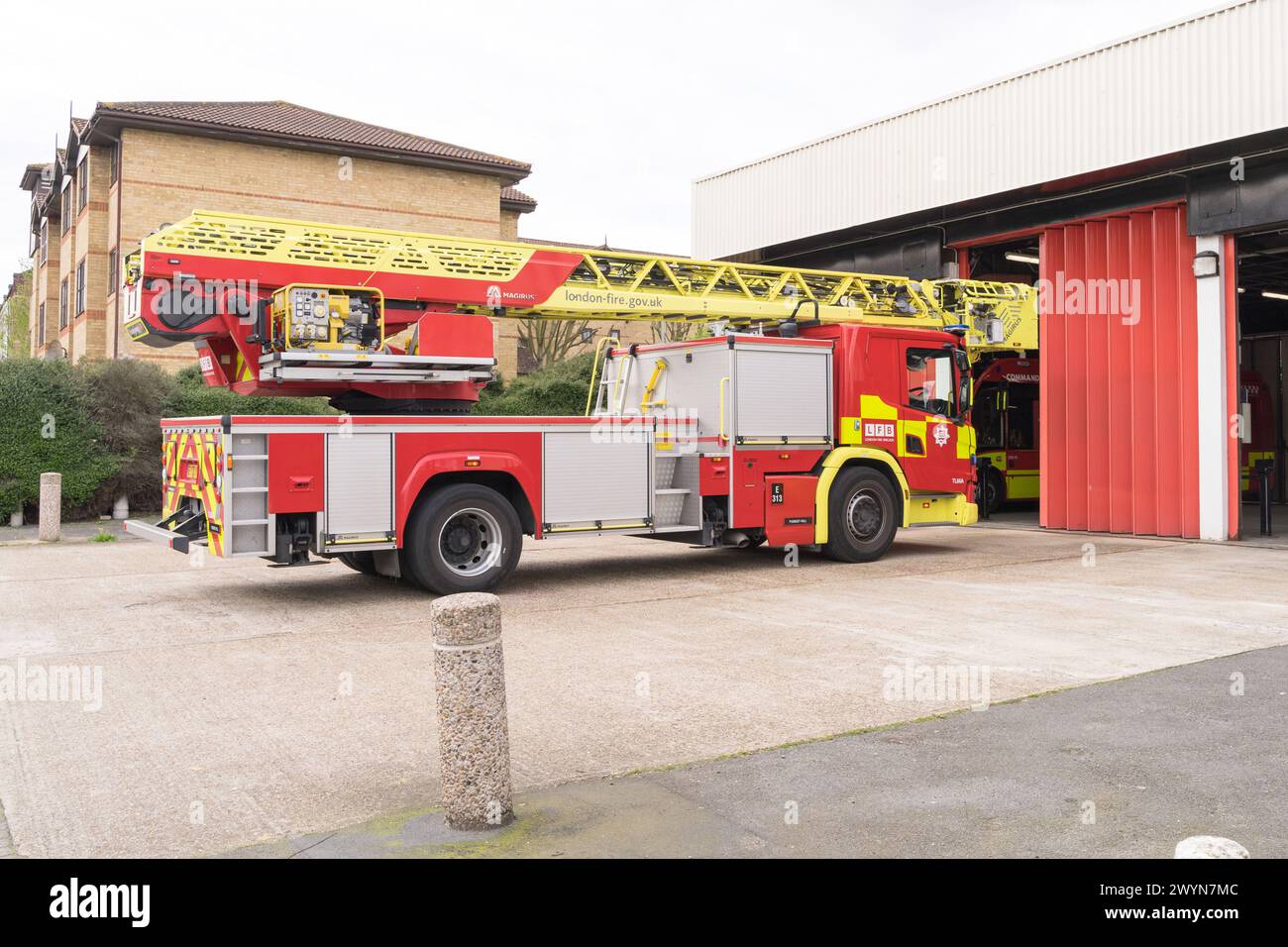 near side view of a fire engine returning to depot in Lewisham fire ...