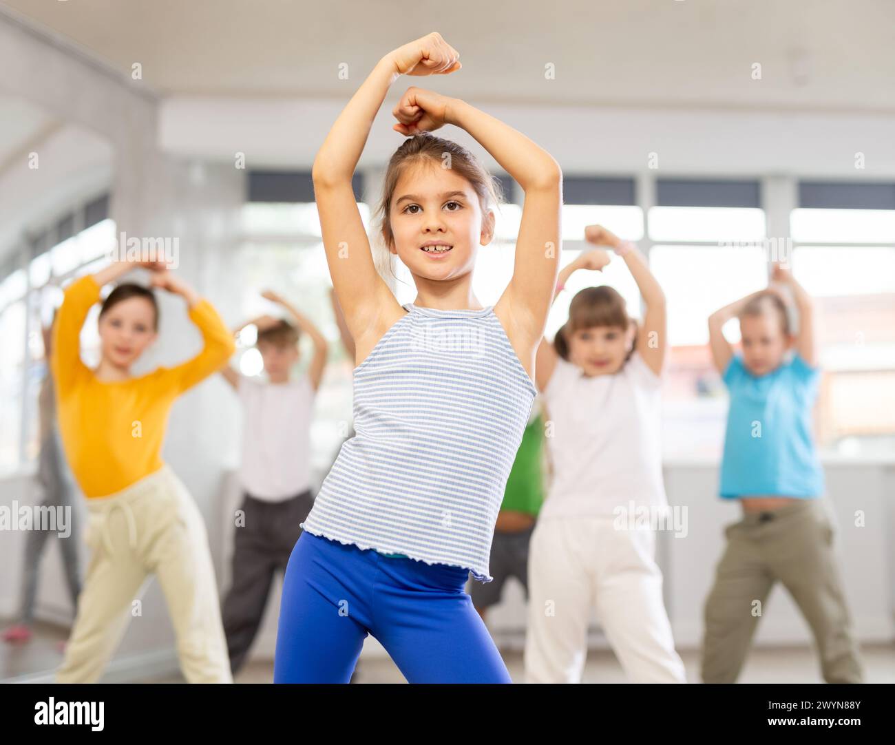 Girl learn to dance hip hop dances, doing movement with unrecognizable ...