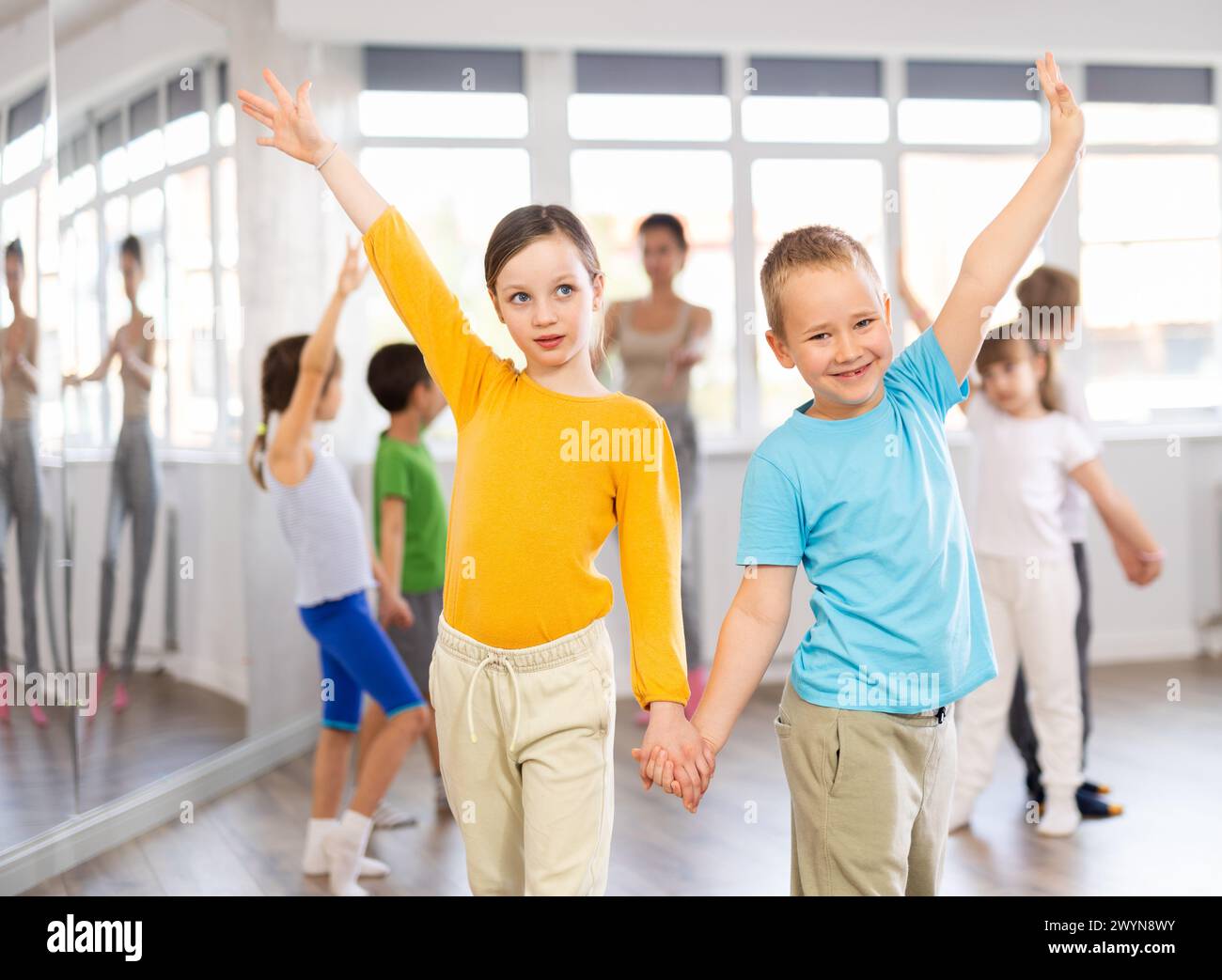 Group of children dancing couple twist dance Stock Photo - Alamy