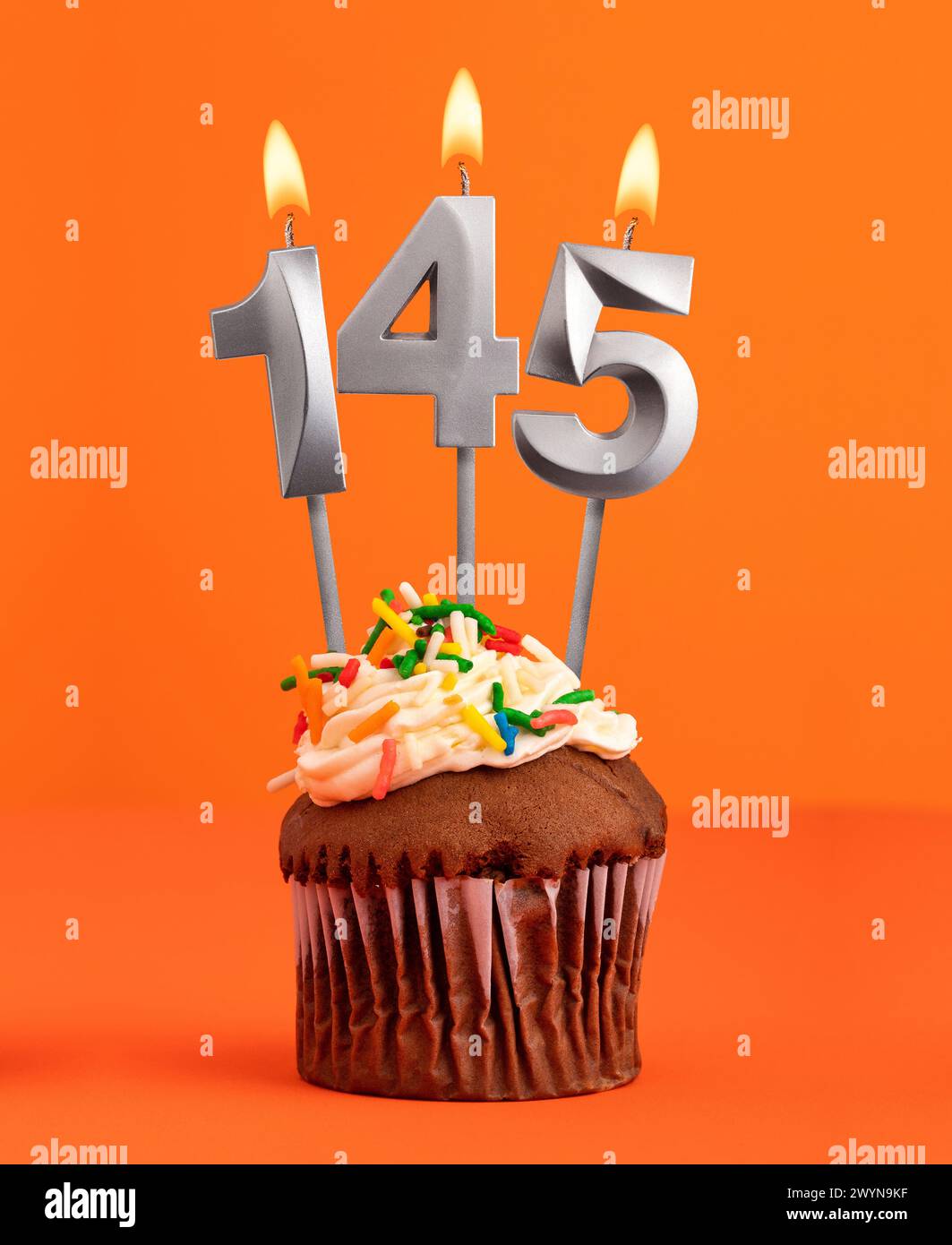 Number 145 candle - Birthday cupcake on orange background Stock Photo ...