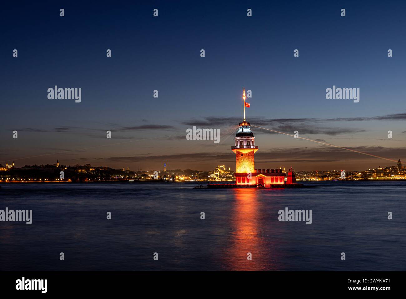 iery sunset over Bosphorus with famous Maiden's Tower (Kiz Kulesi) also ...
