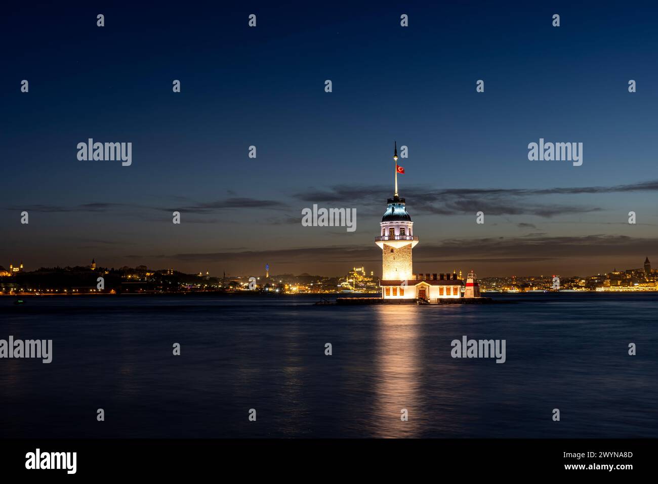 iery sunset over Bosphorus with famous Maiden's Tower (Kiz Kulesi) also ...