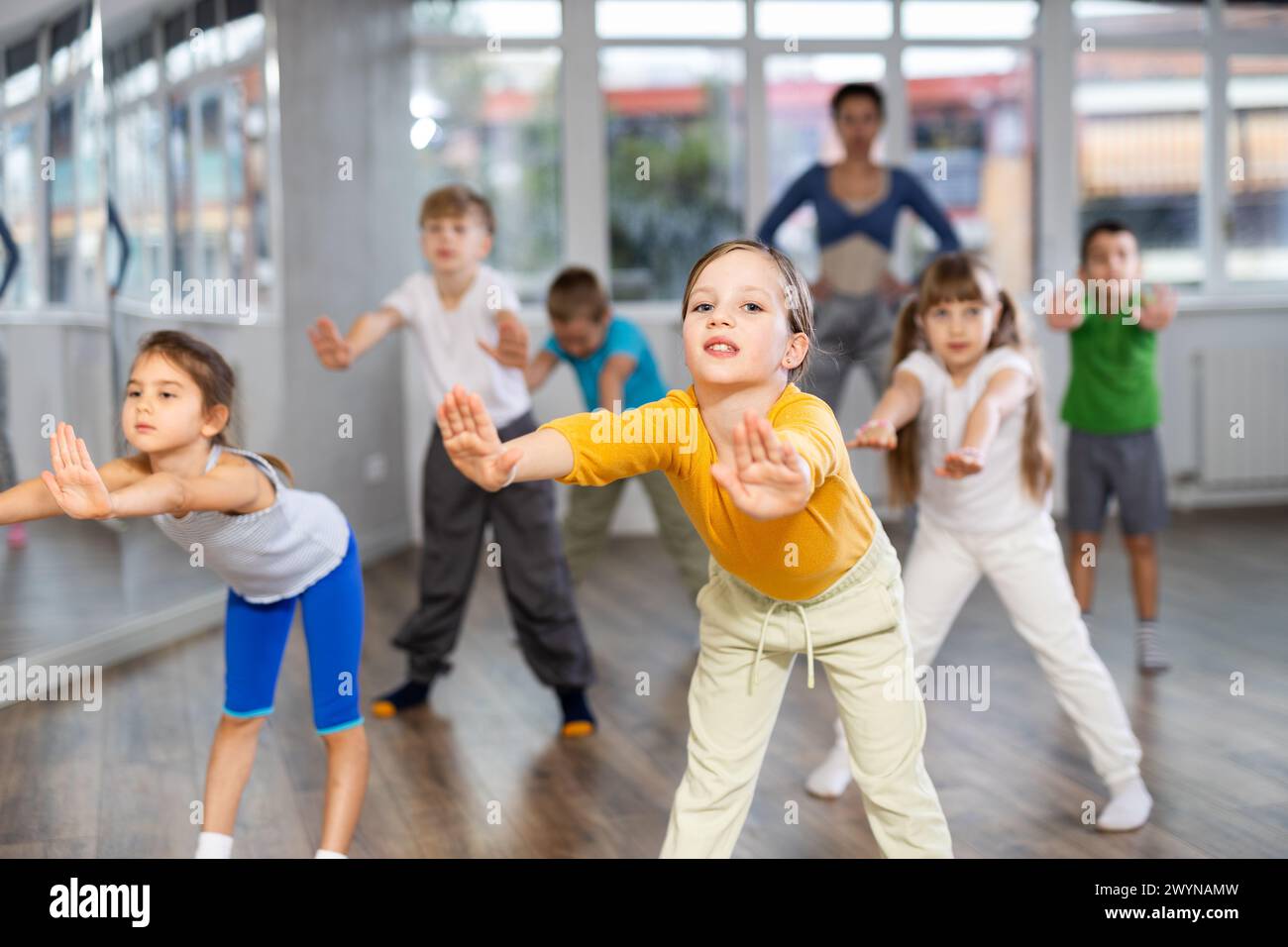 Group of children warming up before dance class Stock Photo - Alamy