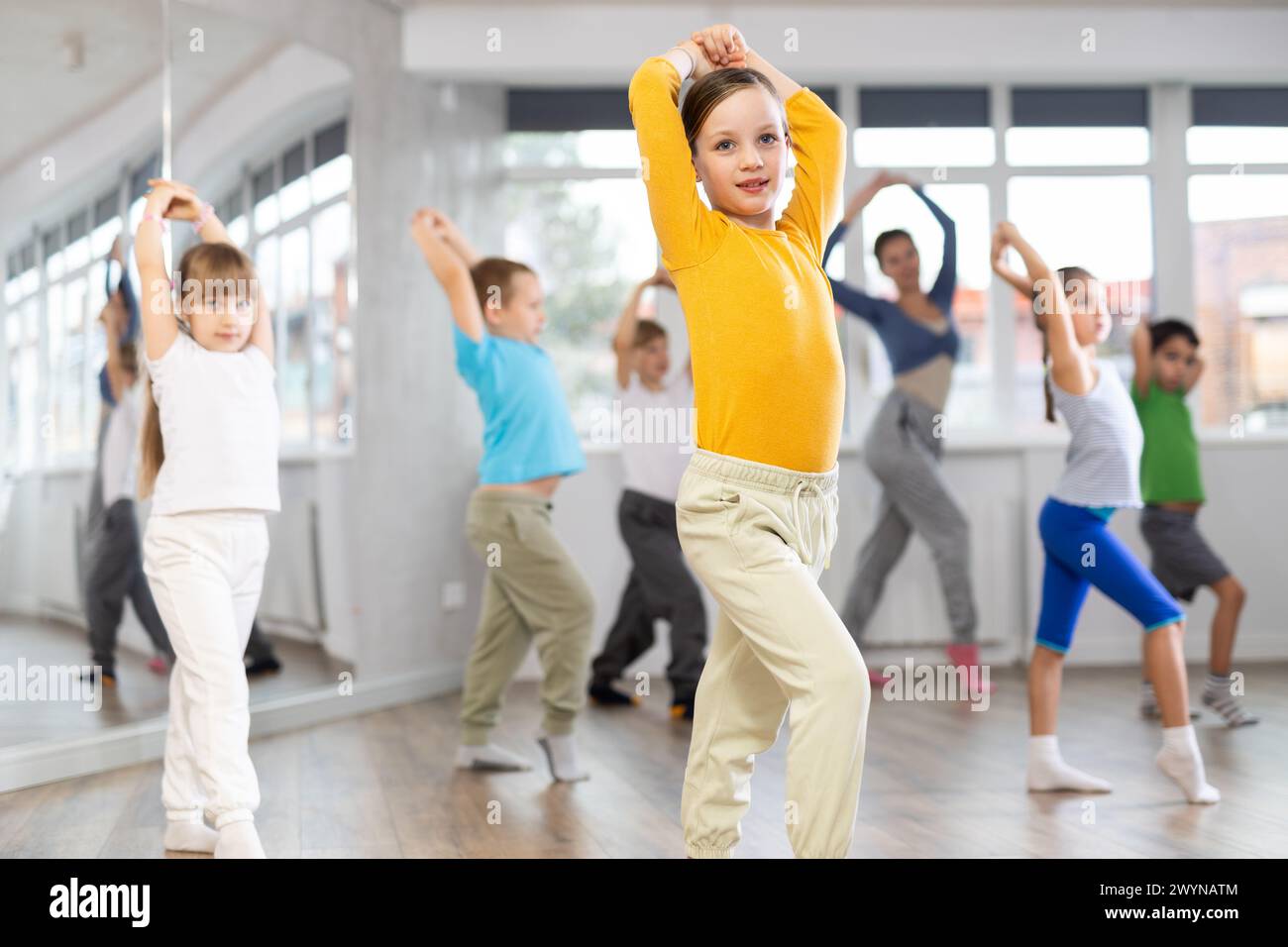 Group of children dancing contemporary dance Stock Photo - Alamy
