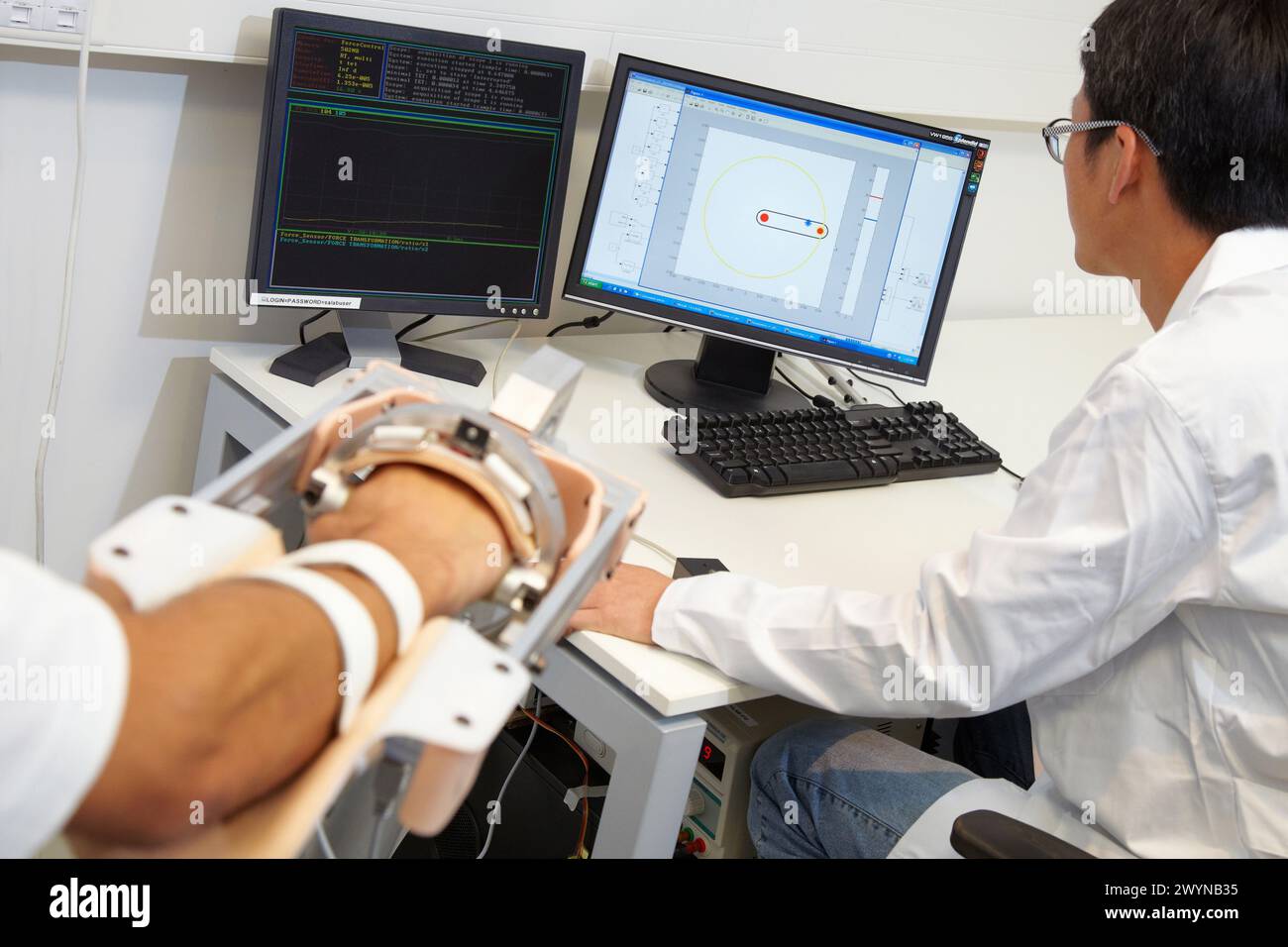 Researcher placing a patient clinical training device of the limb has ...