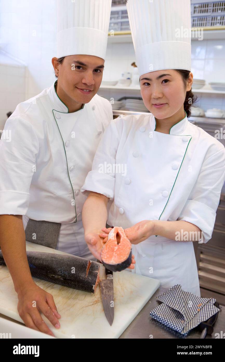 Chefs cutting salmon. Luis Irizar cooking school. Donostia, Gipuzkoa ...