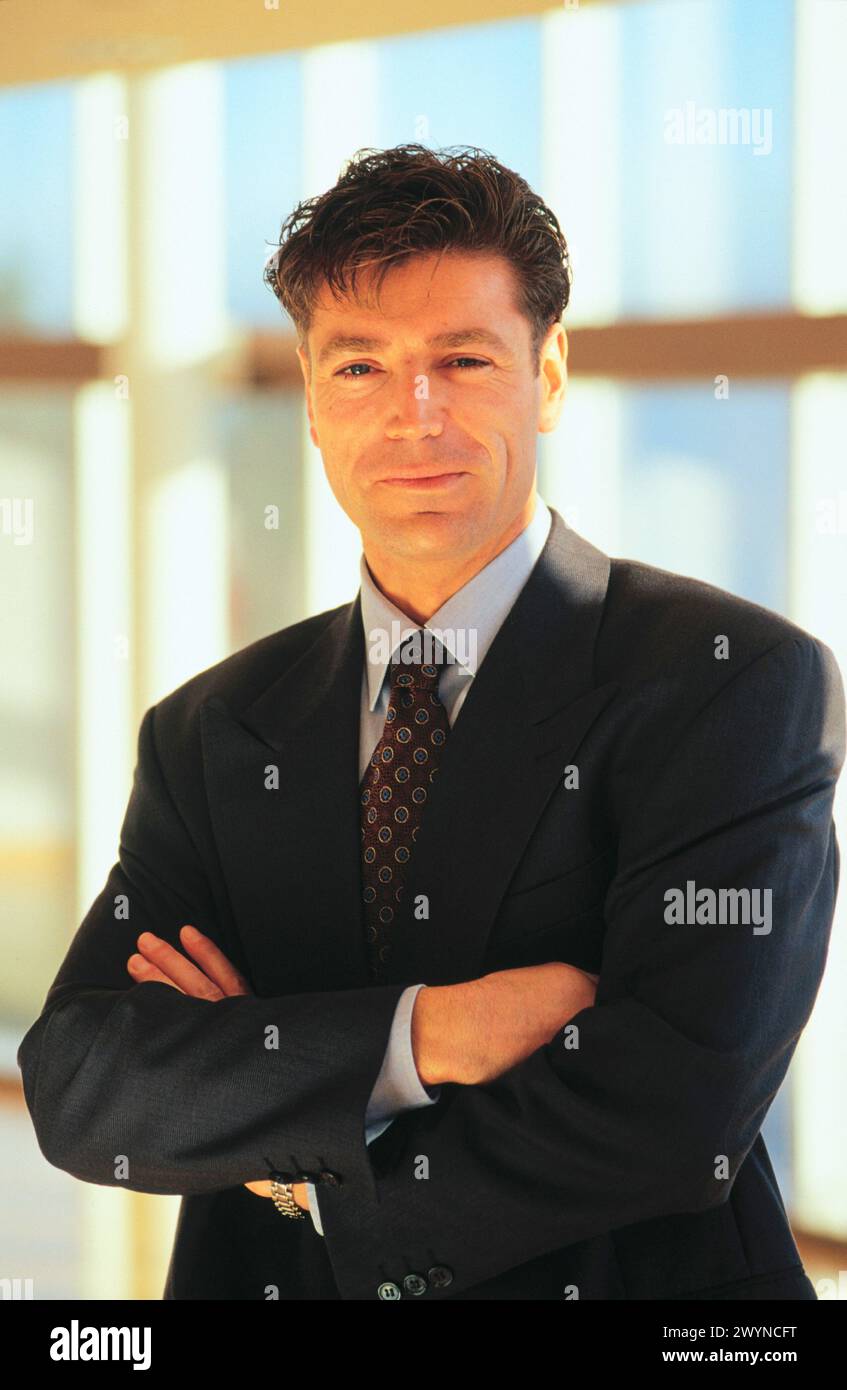 Assured man standing cross hi-res stock photography and images - Alamy