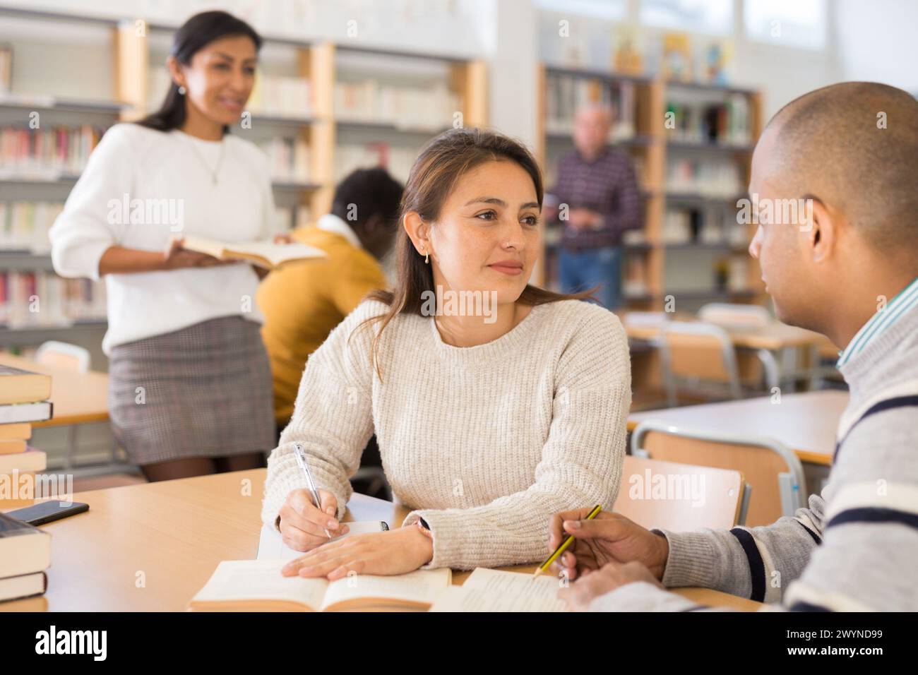 Adult people gaining skills at public library Stock Photo - Alamy