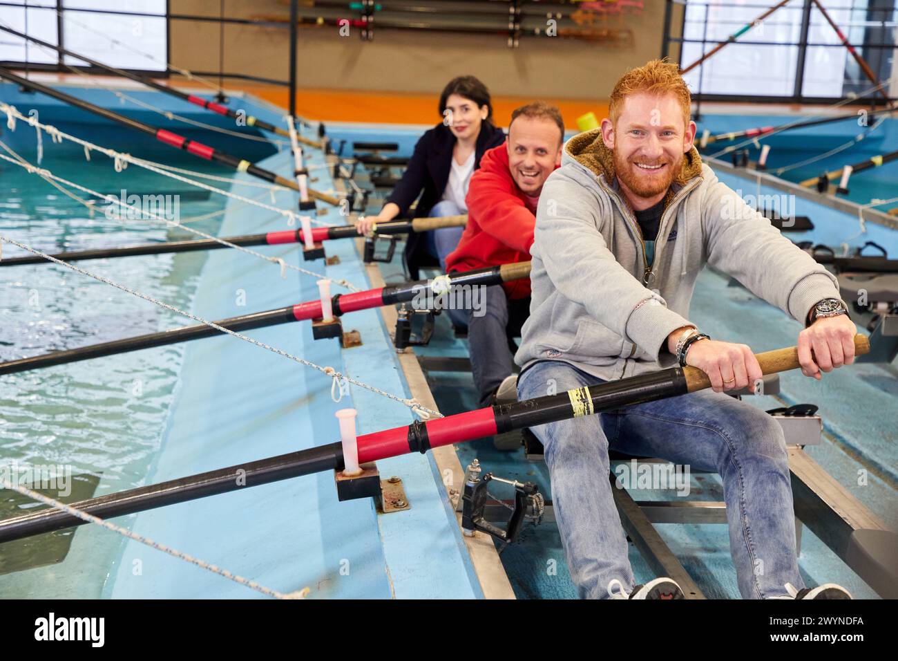 Guide teaching tourists the rowing training facilities, Rowing Company ...
