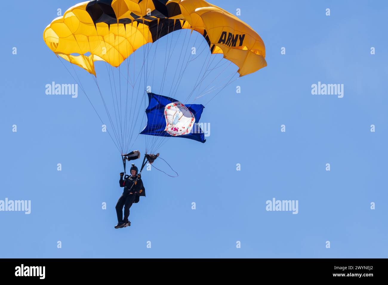 Staff Sgt. Justin Drake of the U.S. Army Parachute Team flies the ...